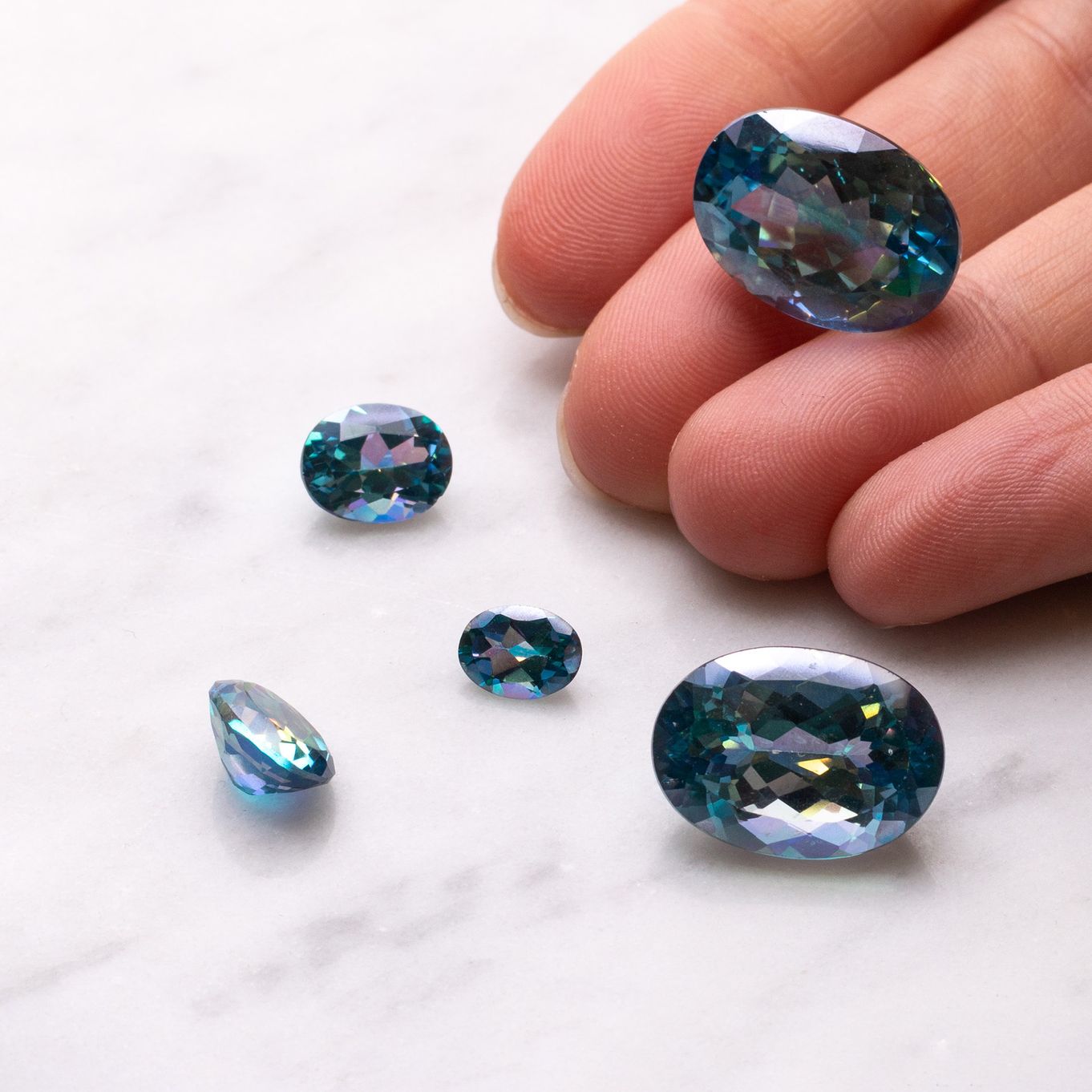 Iridescent Aqua Topaz Faceted StonesThese beautiful aqua faceted ...